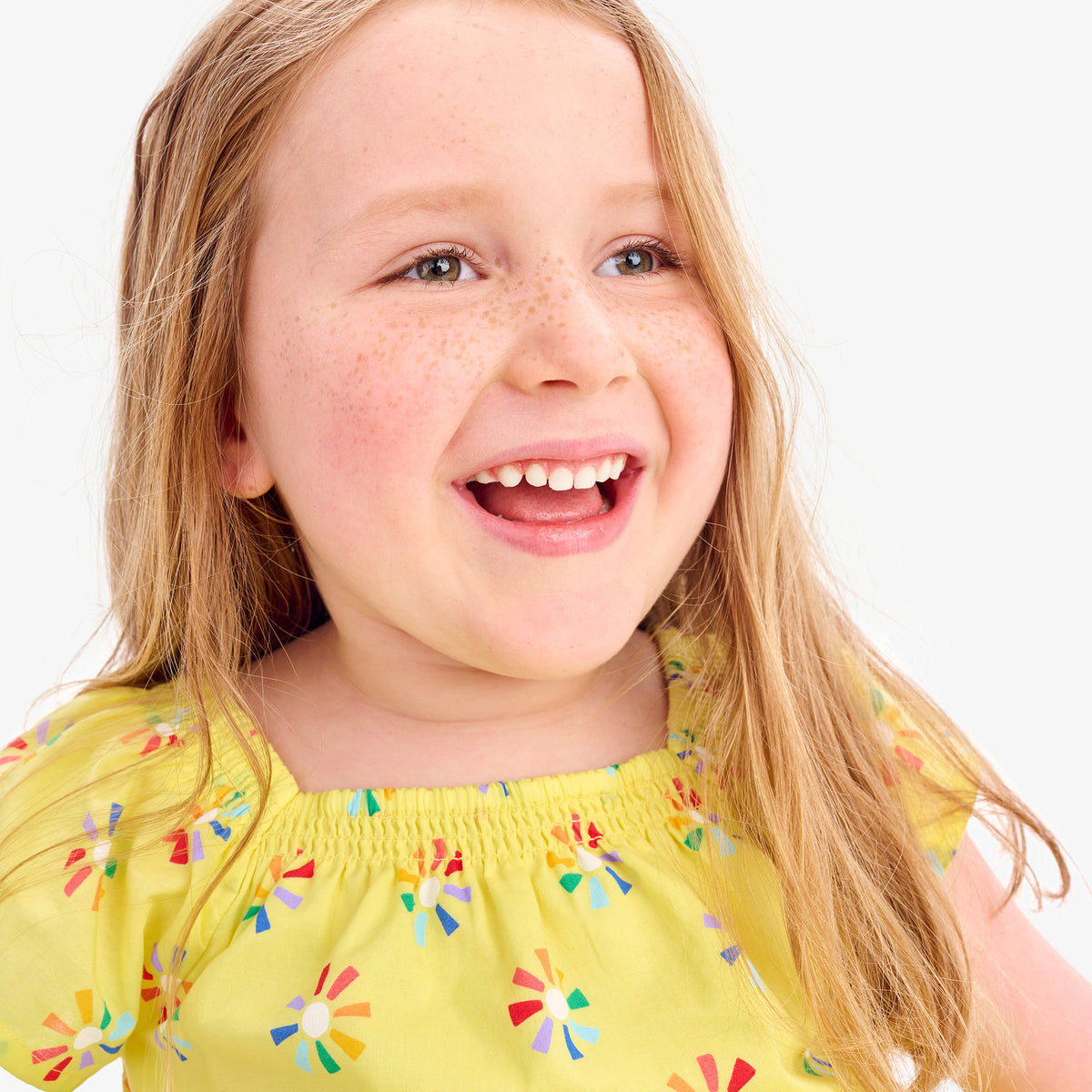 Kids picnic dress in rainbow cutout suns | Primary.com